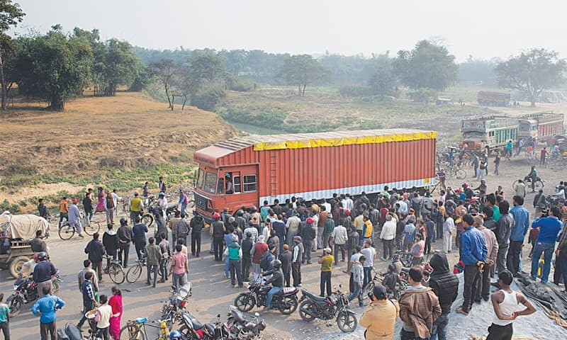 Trucks cross Nepal border as blocked checkpoint reopens - Newspaper ...