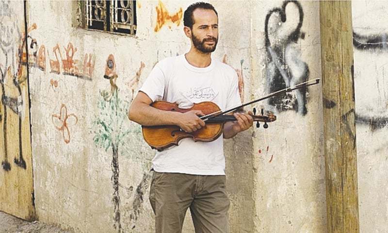 Palestinian violinist brings music to young refugees - World - DAWN.COM
