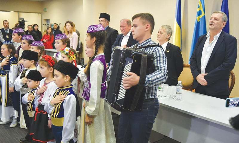 Crimean Tatars freed by Russia arrive as heroes in Ukraine - Newspaper ...