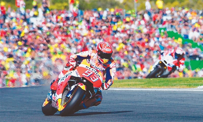 Marquez wins fourth world title in last race of MotoGP season ...