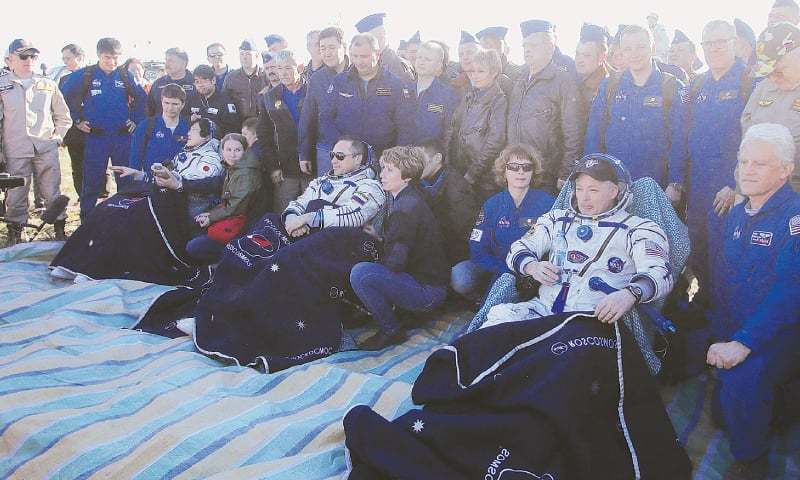 Trio reach Earth from ISS with football slated for use in World Cup ...