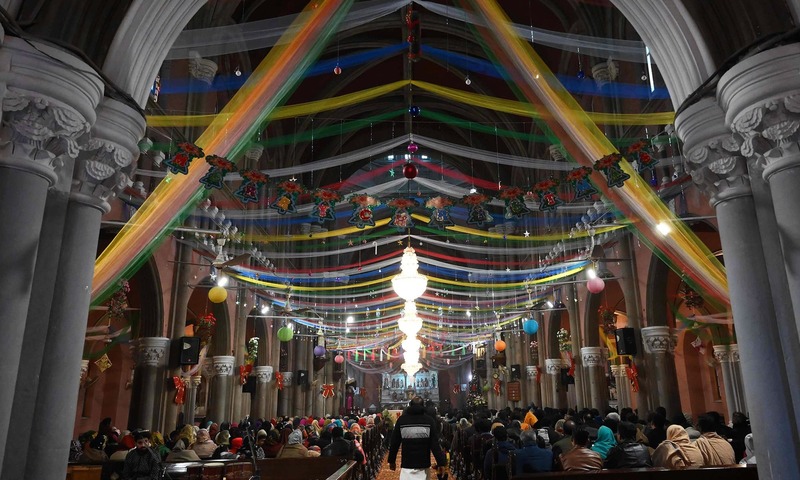 Lights, prayers and hugs: Christians celebrate Christmas across ...