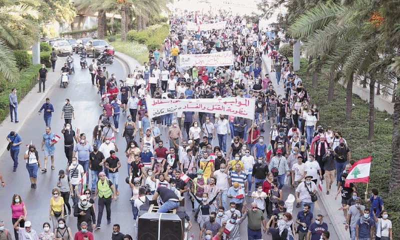 Hundreds march in Lebanon to mark year of protests - World - DAWN.COM
