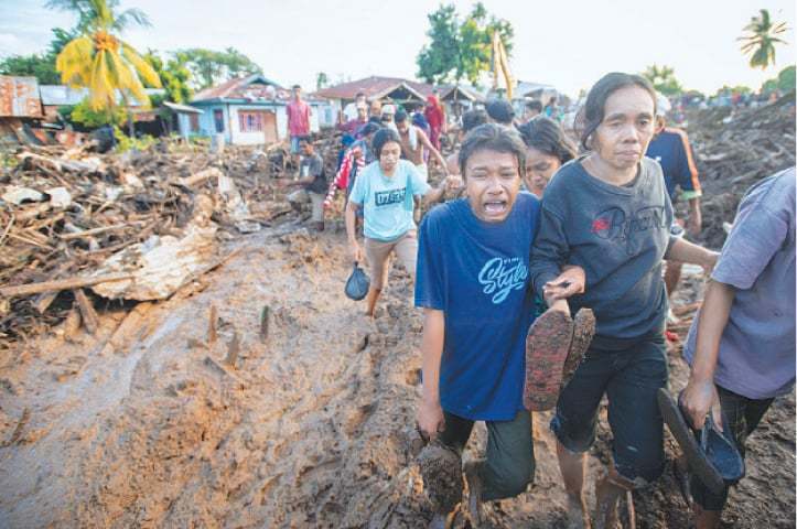 Race to find dozens missing after Indonesia, East Timor floods ...