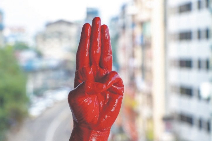 Activists splash red paint to protest junta bloodshed in Myanmar ...