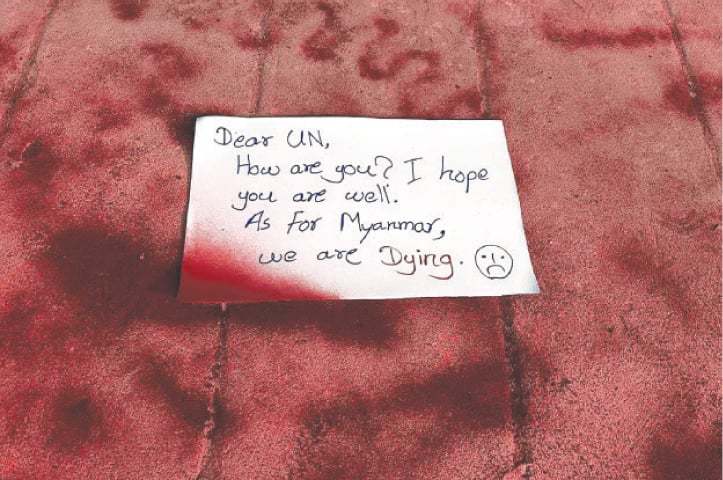 Myanmar protesters throw red paint in streets as death toll mounts ...