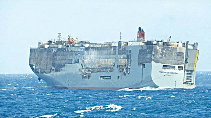 Dutch authorities tow fire-struck cargo ship to new location ...