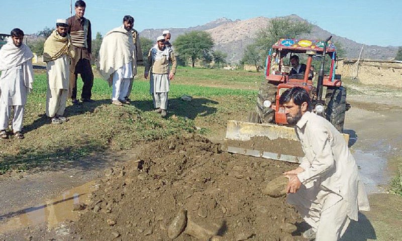 Volunteers build shingle road in Mohmand - Pakistan - DAWN.COM