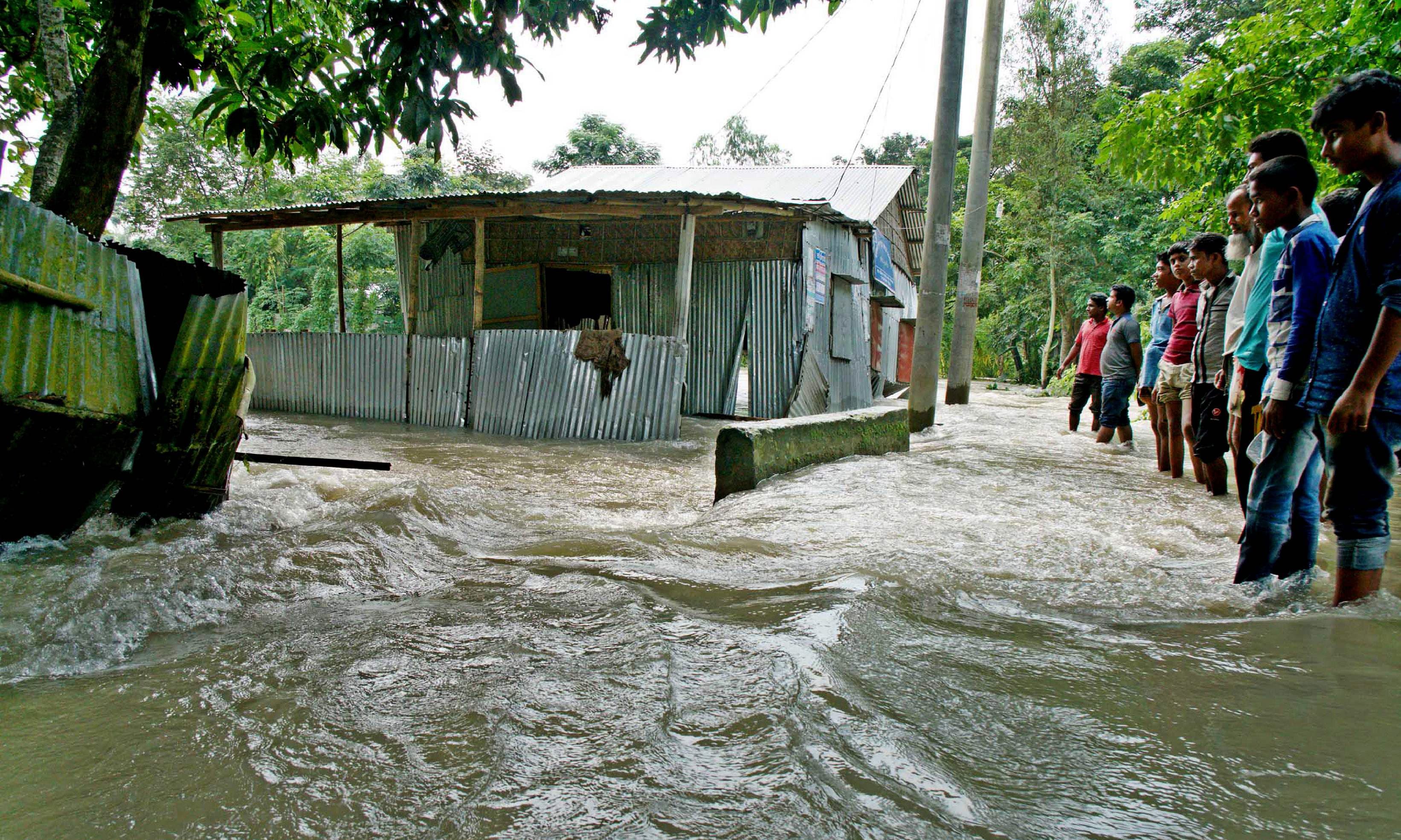 Death toll from flooding, landslides rises to 218 in South Asia - World ...