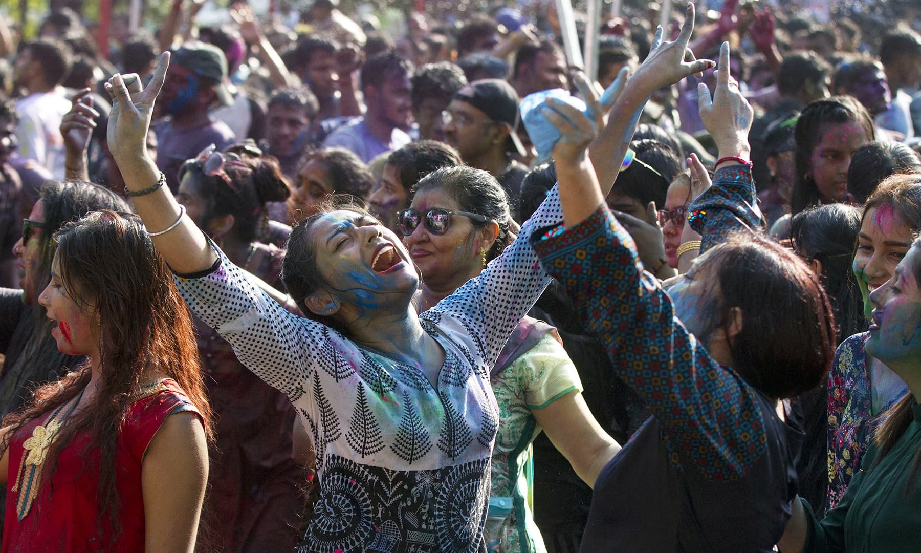 In pictures: Everything turns technicolour as revellers across Asia ...